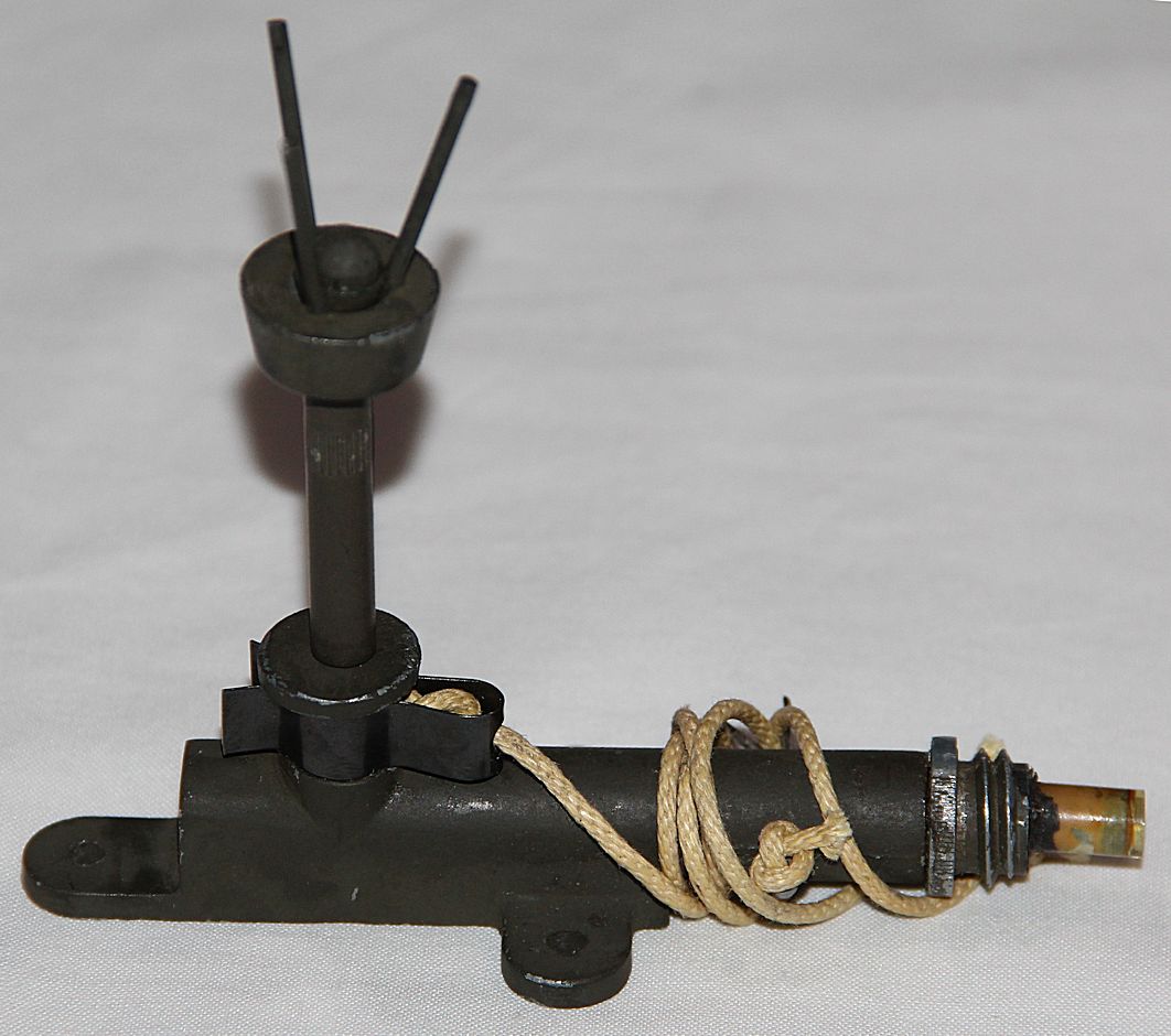 E512. INERT WWII M1A1 PRESSURE FIRING DEVICE WITH THREE PRONG EXTENSION ...